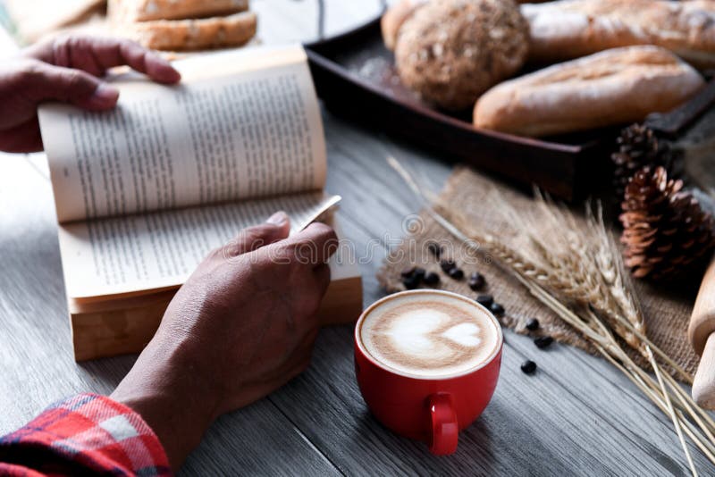 Heart Coffee in Red Cup with People Reading a Book. Stock Image - Image ...