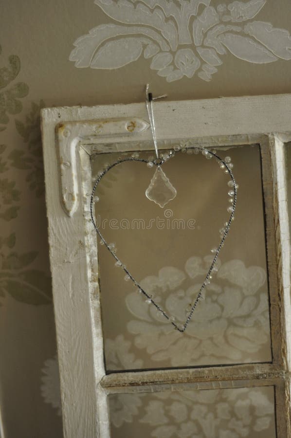 Heart Decoration Made of Wire Hanging from a Old and Rustic Window ...
