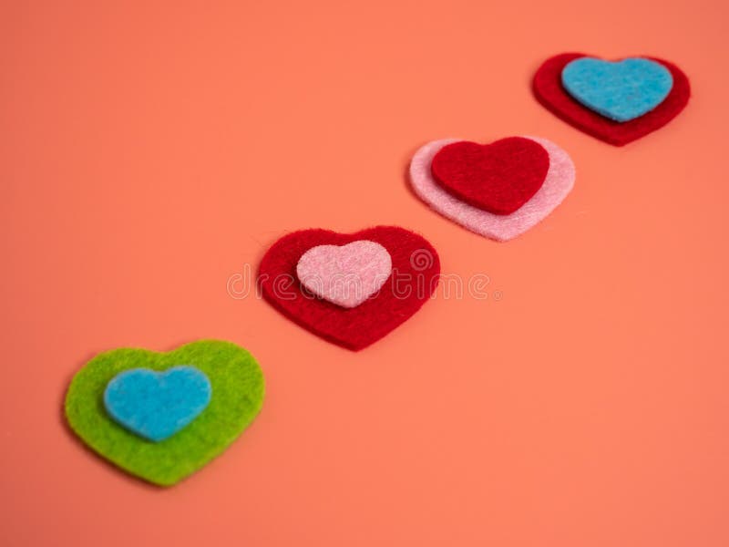 Heart of Different Colors on a Pink Background. Stock Image - Image of ...