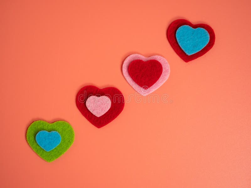 Heart of Different Colors on a Pink Background. Stock Image - Image of ...