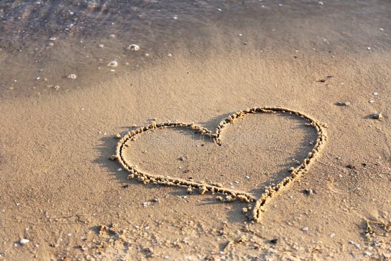 Heart drawn on beach sand stock photo. Image of happiness - 151230094