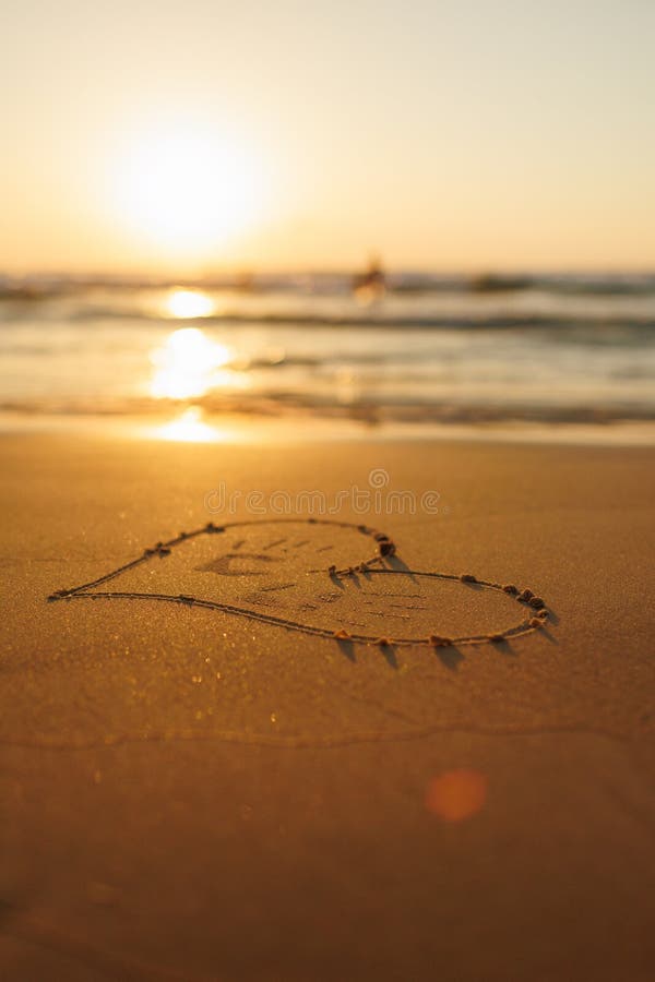 A Heart is Drawn on the Sand on the Beach at Sunset. Romantic Sunset on ...