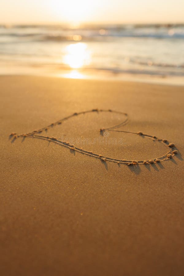 A Heart is Drawn on the Sand on the Beach at Sunset. Romantic Sunset on ...