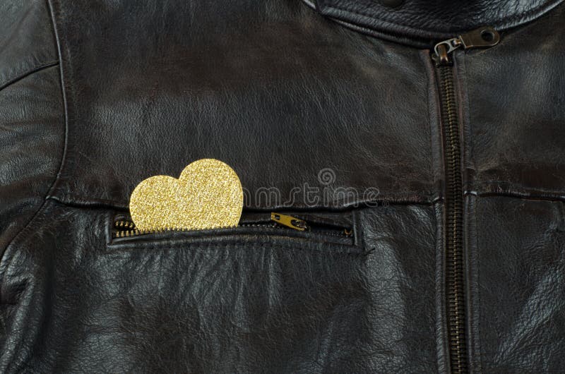 Heart of Gold on Black Leather Jacket Stock Image - Image of metal ...