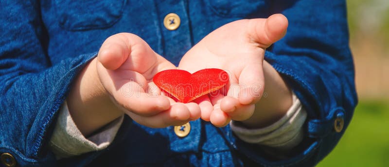 The Heart is in the Hands of the Child. Stock Image - Image of ...
