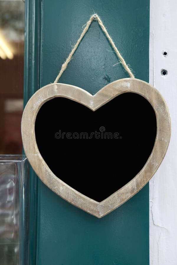 Heart hanging on door shop stock image. Image of leaf - 15044509