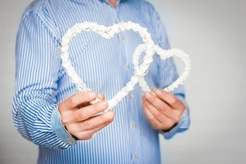 A Heart in Human Hands on White Brick Background Stock Photo - Image of ...