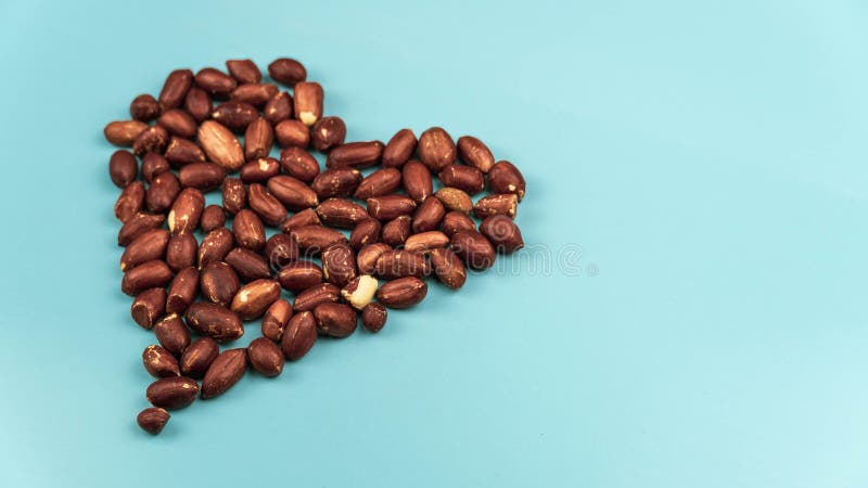 Peanuts on a Blue Background Stock Photo - Image of tasty, peanut ...