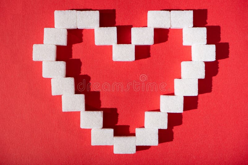 Heart Made of Cubes of Sugar on a Red Background. Empty Place for Text ...