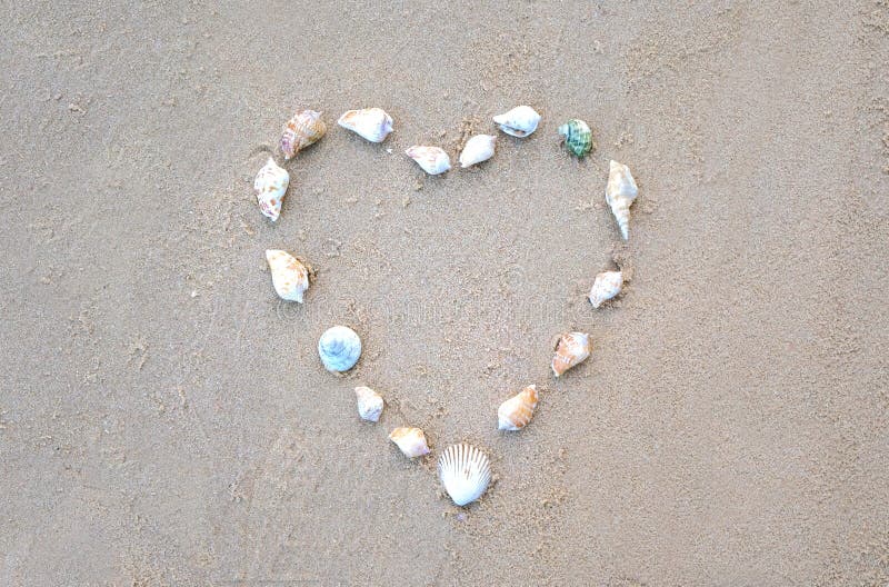 A Heart Made of Shells on the Sand Stock Photo - Image of pattern ...