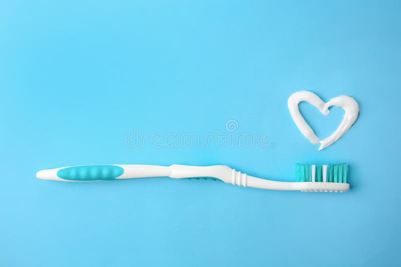 Heart Made with Toothpaste and Brush on Light Blue Background, Top View ...