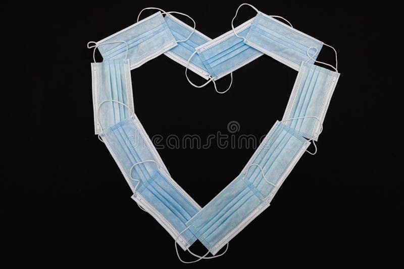 A heart made with masks stock photo. Image of gift, blue - 207520198