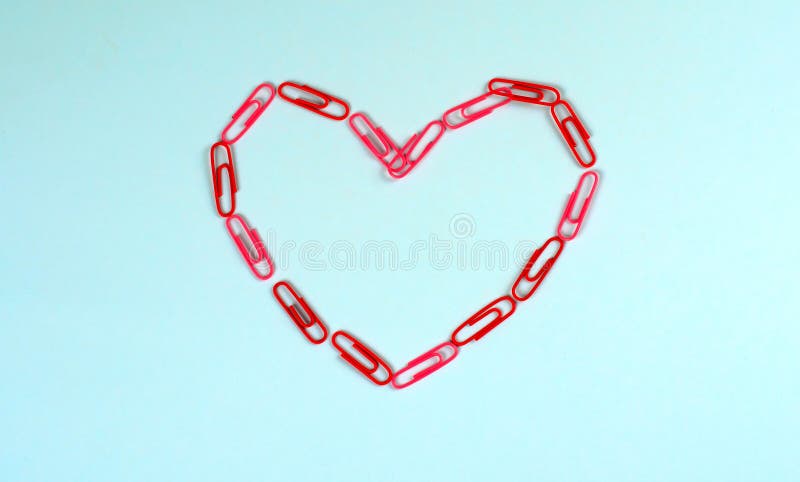 Heart of Office Paper Clips on a Blue Background. Stock Image - Image ...