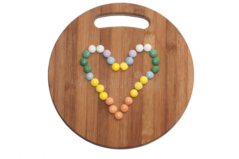 Heart of the Round Chocolate Candies on a Wooden Board Stock Photo ...
