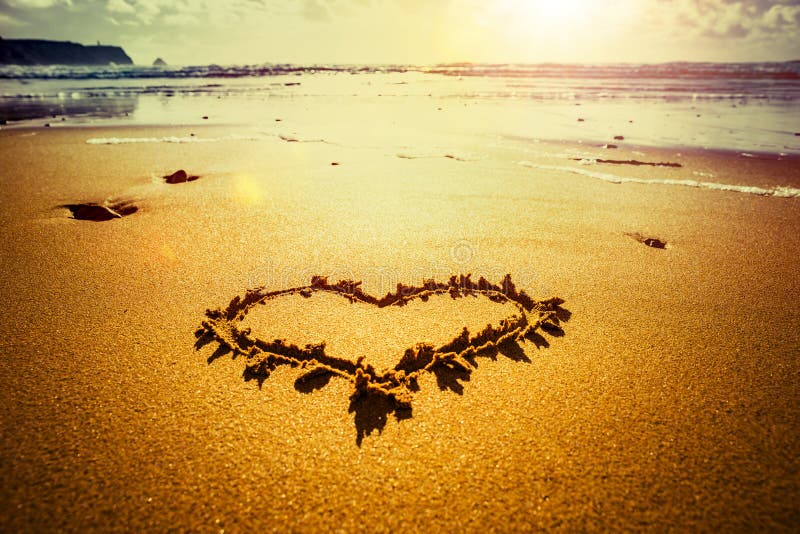 Heart of sand on the beach stock photo. Image of design - 170385108
