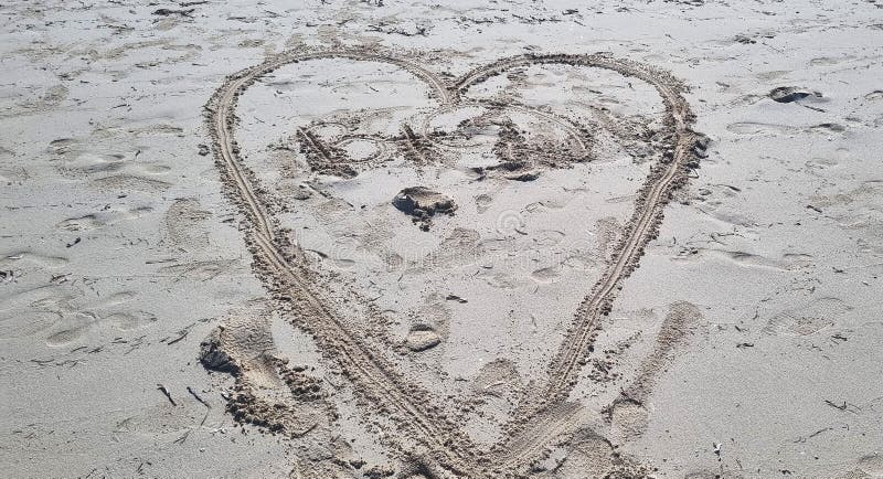 Heart Shape Drawn in the Sand of the Beach. Love Stock Image - Image of ...