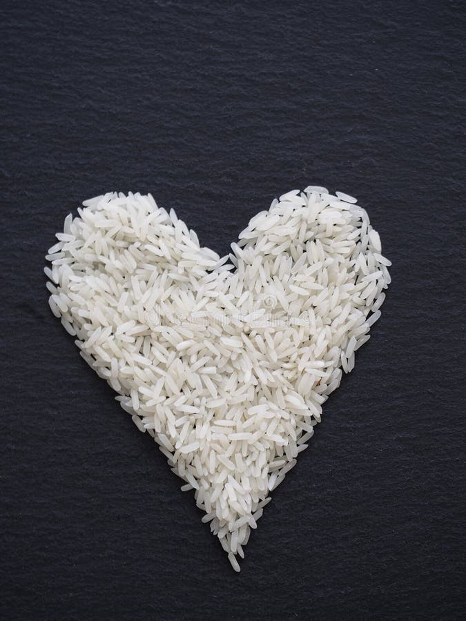 Heart Shape Made of Rice, on a Black Slate Background Stock Image ...