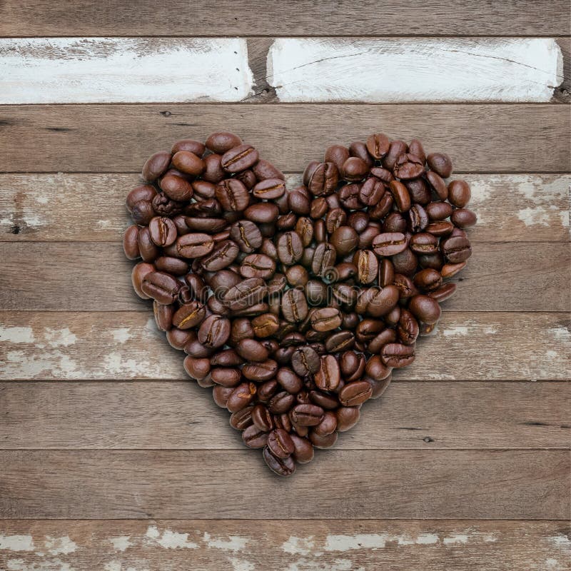 Heart Shape of Roasted Coffee Beans on Wood Background. Stock Photo ...