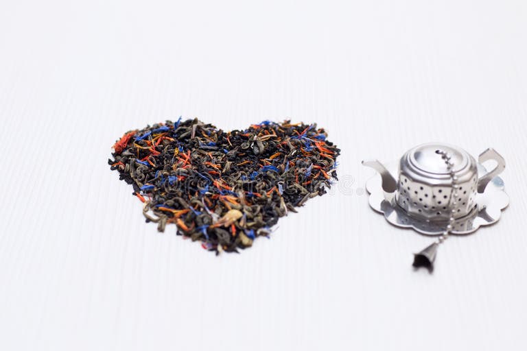 Heart Shape of the Tea Leaves on a White Table at Home Stock Photo ...