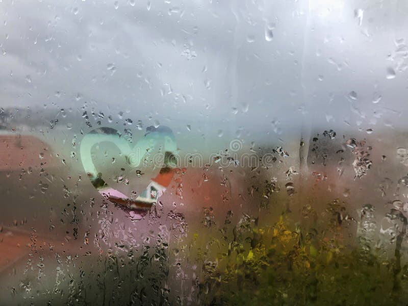 Heart Shape on the Wet Window Pane with Rain Drops Stock Photo - Image ...