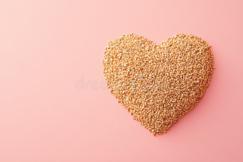 Heart-shaped Arrangement of Sesame Seeds on a Soft Pink Background for ...
