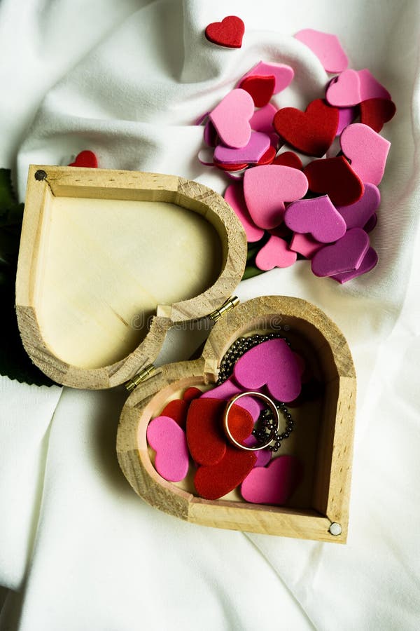 A Heart-shaped Box with Hearts and a Ring. Valentine`s Day Stock Photo ...