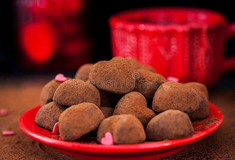 Heart Shaped Chocolate Truffles on Red Plate Stock Image - Image of ...