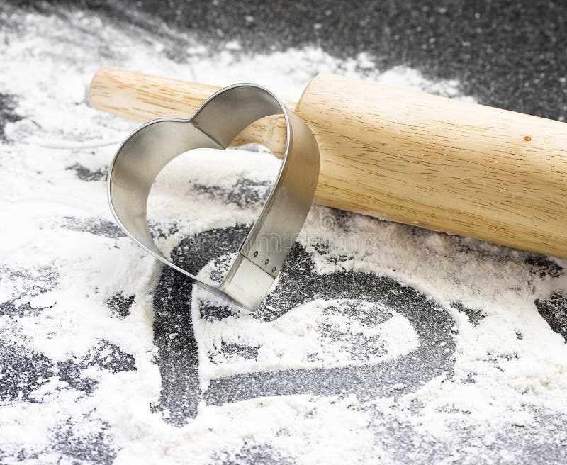 Heart Shaped Cookie Cutter and a Rolling Pin Stock Photo - Image of ...