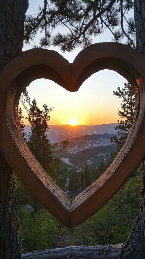 A Heart-shaped Frame Capturing a Beautiful Scenic Sunset. Stock ...