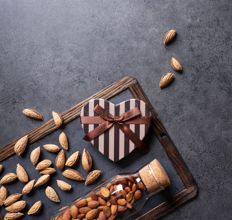 Heart Shaped Gift Box with Almonds Around, Flat Lay Stock Image - Image ...