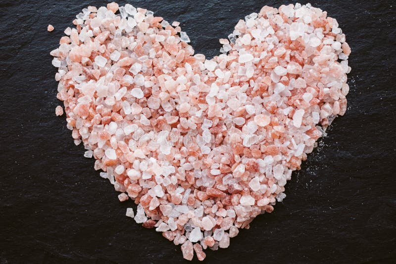 Heart Shaped Himalayan Salt on Board Background. Top View Stock Photo ...
