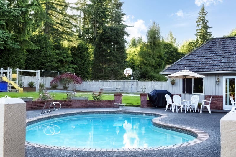 Heart Shaped Home Swimming Pool in Large Backyard Stock Photo - Image ...