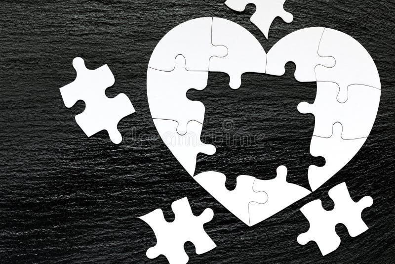 Heart-shaped Jigsaw Puzzle on Color Background. Puzzle Heart on Wooden ...