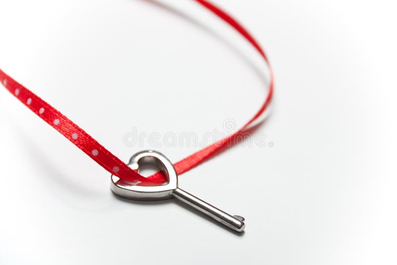 Heart Shaped Key and Red Ribbon Stock Photo - Image of worn, shape ...