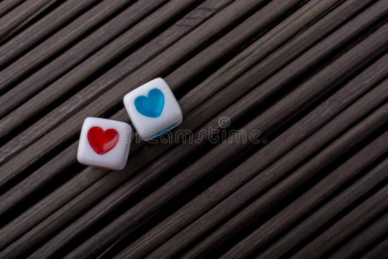Heart Shaped Love Cubes on a Straw Mat Stock Photo - Image of together ...