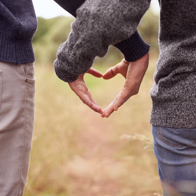 Heart-shaped Love. Two Young People Outside Making a Heart Shape with ...