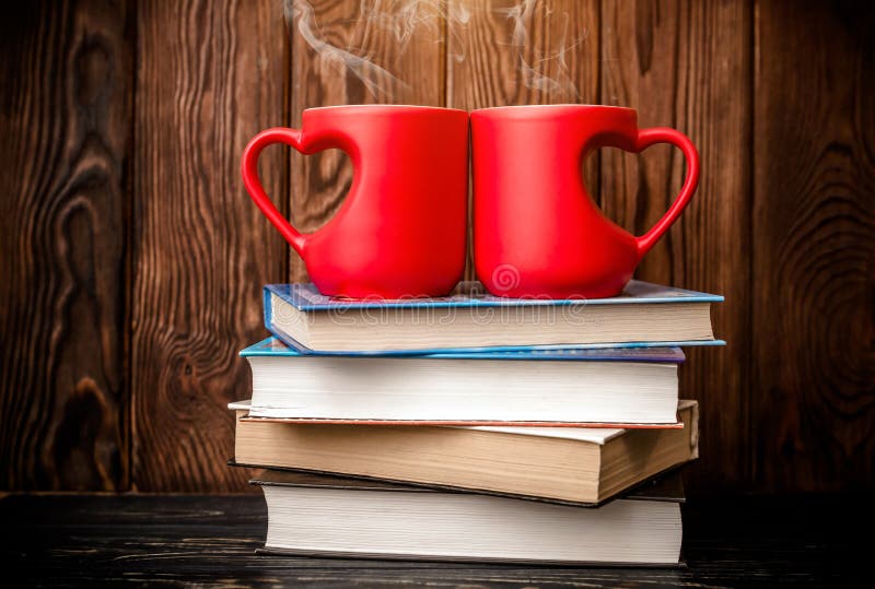 Heart Shaped Mugs is on a Stack of Books Stock Photo - Image of ...