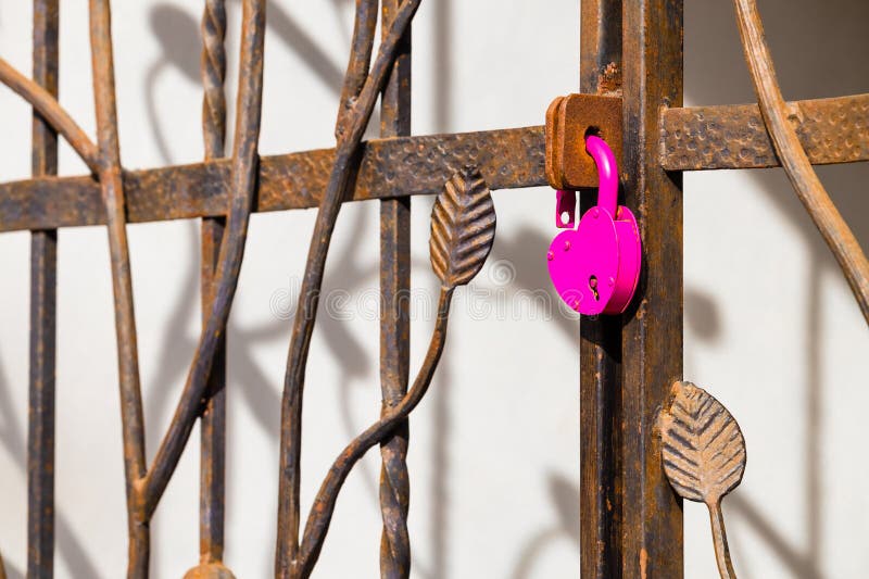 A Heart-shaped Padlock Hanging on a Metal Gate Editorial Stock Image ...