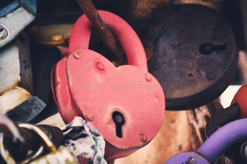 Heart Shaped Padlock among Many Old Rusty Locks. Stock Image - Image of ...