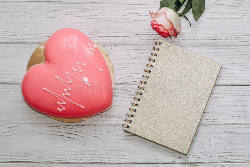 Heart Shaped Pink Mousse Cake on Table with Rose and Notepad. Stock ...