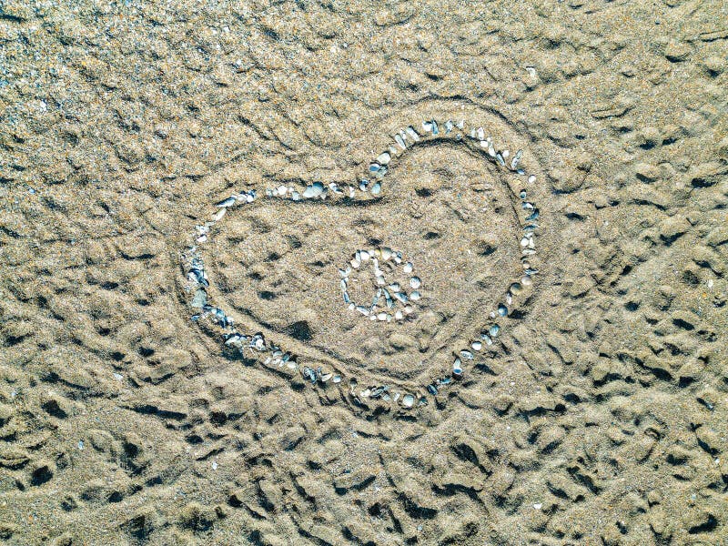 Heart-shaped Stone on a Sandy Beach Stock Image - Image of erosion ...