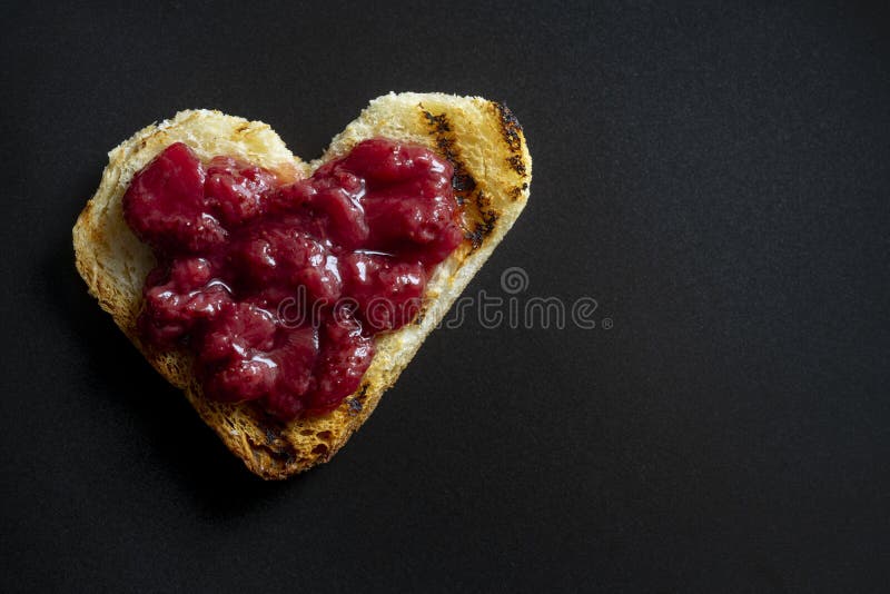 Heart Shaped Toast with Strawberry Jam, Isolated on Black Stock Image ...