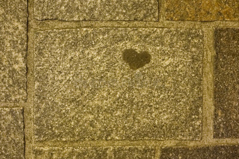 Heart-Shaped Wet Spot on Stone Pavement Stock Photo - Image of wall ...
