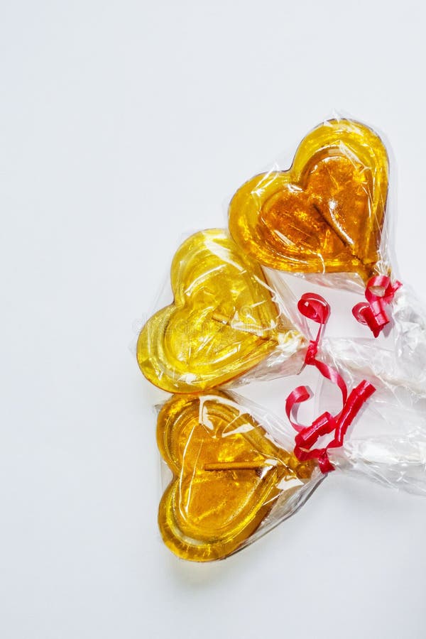 Heart Shaped Yellow Sugar Candy in Transparent Packaging Stock Photo ...