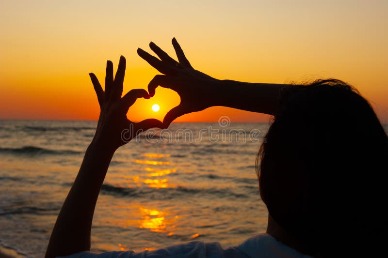 Heart Sign Against the Sunset, Sunrise on the Sea Stock Image - Image ...