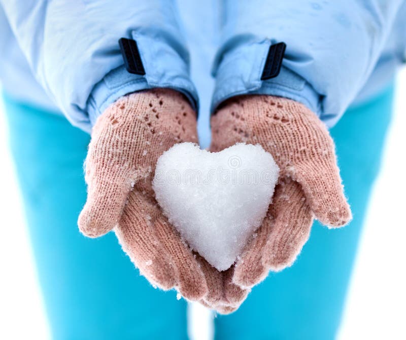 Hands in Knitted Mittens with Heart of Snow in Winter Day. Love Concept ...