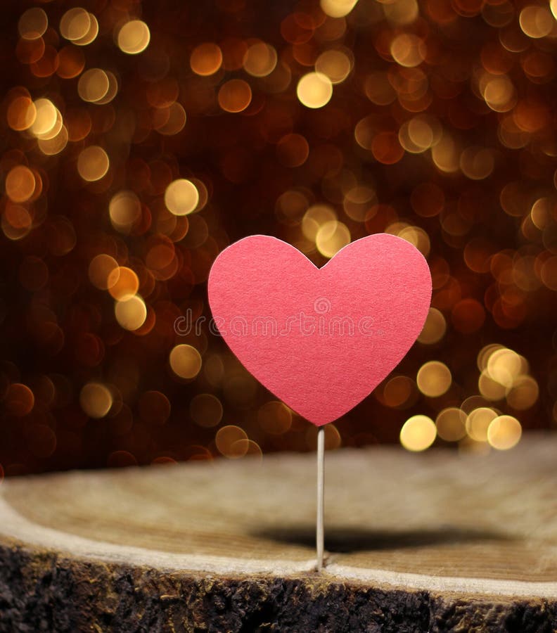 Heart on a Stick on a Background with Golden Bokeh Stock Image - Image ...