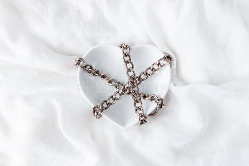 The Heart Symbol in Chains, on a Light Background Stock Image - Image ...