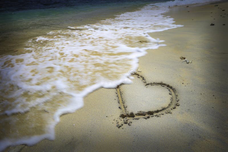 Heart Symbol Drawn in Sand on the Beach Stock Photo - Image of ...