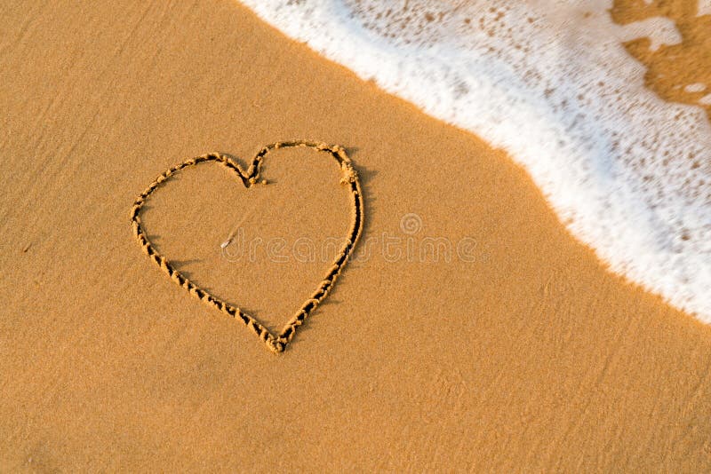 Heart symbol on the sand stock photo. Image of romantic - 360458940